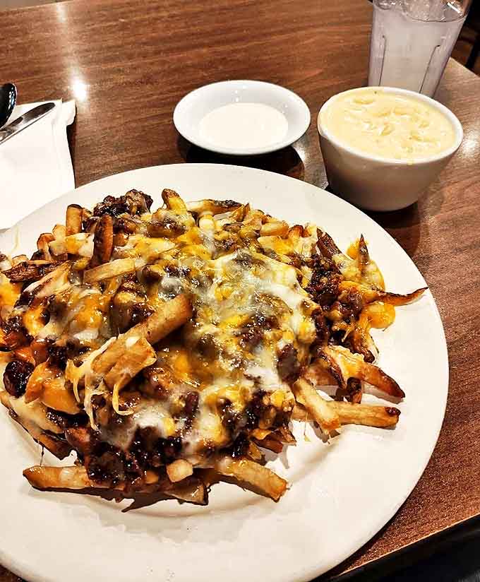 These loaded cheese fries aren't just a side dish, they're a declaration that potatoes have found their highest calling.