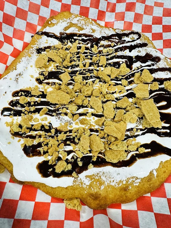 Dessert nirvana achieved: S'mores frybread with marshmallow spread, chocolate drizzle, and graham cracker crumbles brings campfire memories to sophisticated heights.
