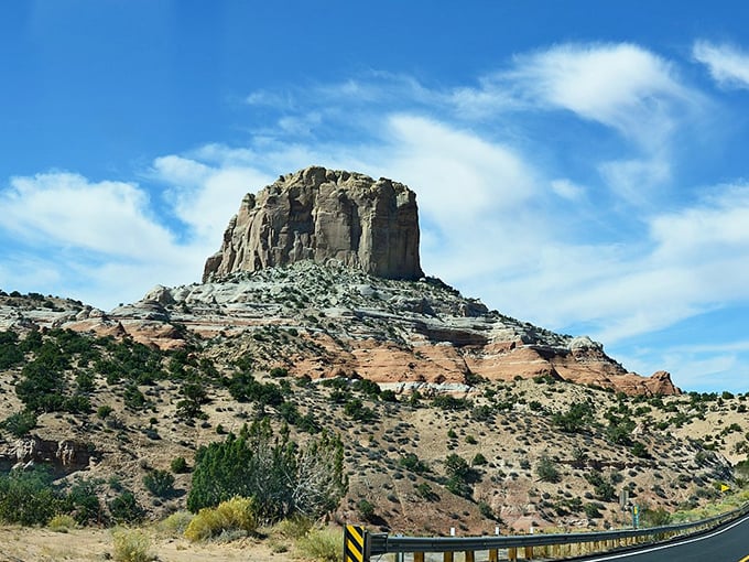 Square Butte rises majestically from the desert floor like nature's skyscraper, its layered walls telling stories of ancient geological drama.