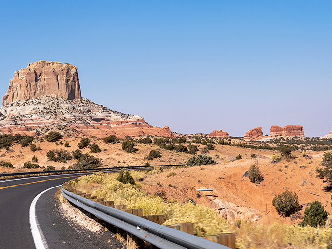 Square Butte commands attention as the road curves gracefully around it, a natural landmark that's impossible to miss or forget.