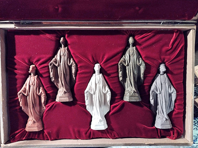 Religious figurines arranged with the reverence of sacred objects and the playfulness of childhood toys – boundaries blur beautifully here.