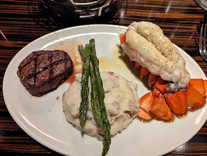 The surf and turf dream team: a perfectly seared steak alongside lobster tail that might make you consider moving closer to the restaurant.