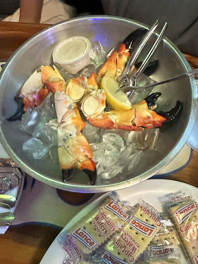 The ritual of cracking, extracting, and dipping stone crab meat becomes a meditation on seafood perfection at Whale's Rib.