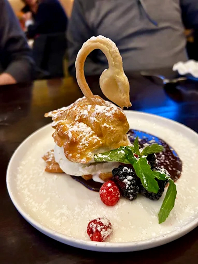 This swan cream puff isn't just dessert&mdash;it's architectural wizardry. The pastry chef clearly missed a calling in structural engineering.