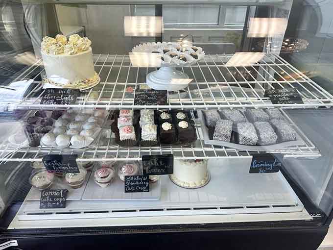 The pastry case displays an impressive array of sweet temptations, from elegant cakes to decadent brownies begging for attention.