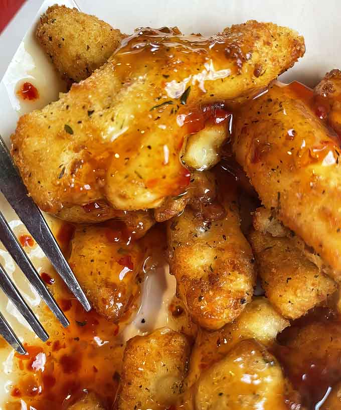 Sweet chili cheese curds prove that sometimes the best ideas come from asking "what if we made them spicy AND sweet?"