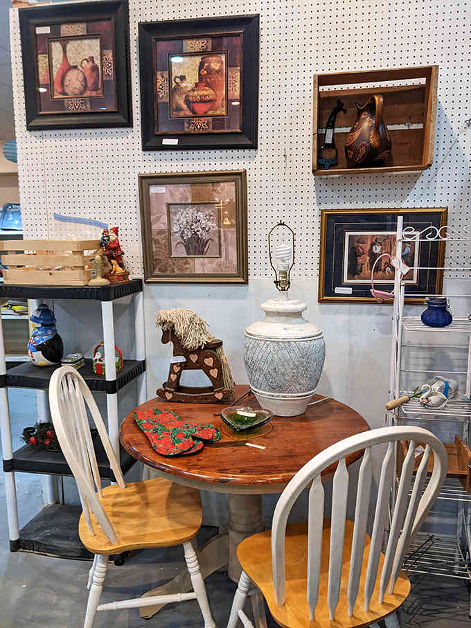 This charming dining set whispers of family gatherings past, the worn wood and mismatched chairs creating the perfect stage for new memories in someone's home.