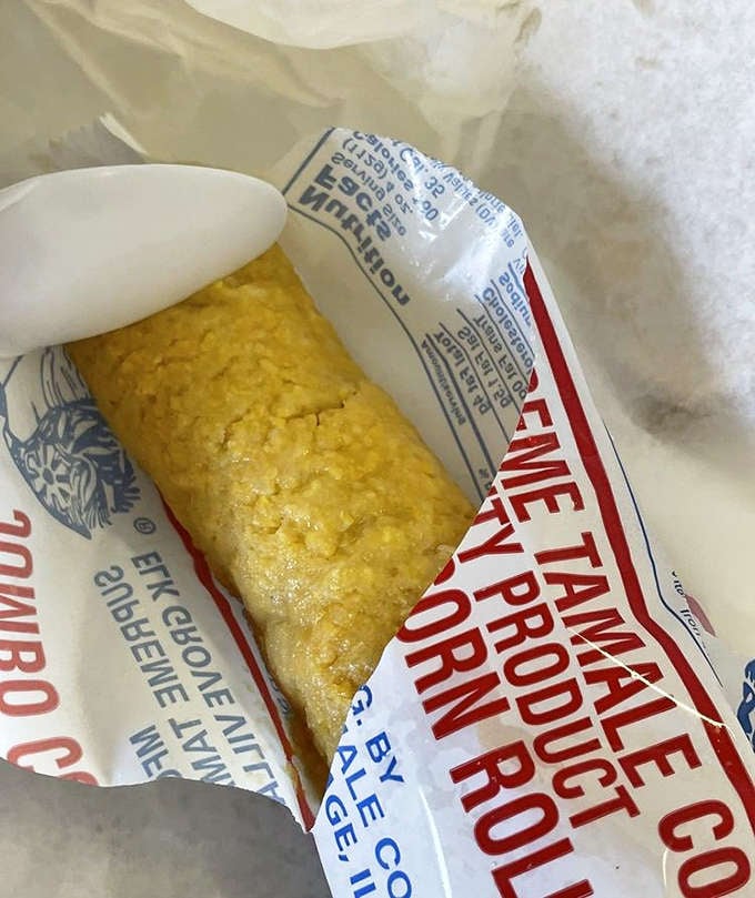 Unwrapping this corn roll tamale is like opening a little present &ndash; a Chicago-style tradition that complements the main attraction perfectly.