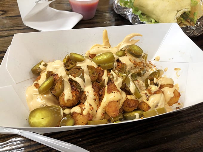 Not your cafeteria's sad spuds &ndash; these golden-brown beauties are dressed in spices and jalape&ntilde;os, with a creamy sauce that makes ketchup seem like amateur hour.