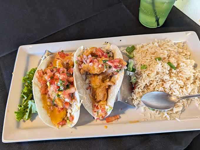 Three tacos, perfectly assembled, proving that good things really do come in threes, especially when seafood's involved.