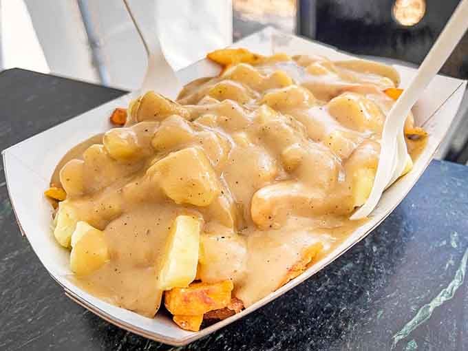 Poutine meets British chippy in this glorious gravy-drenched creation that'll make your cardiologist weep and your taste buds sing.
