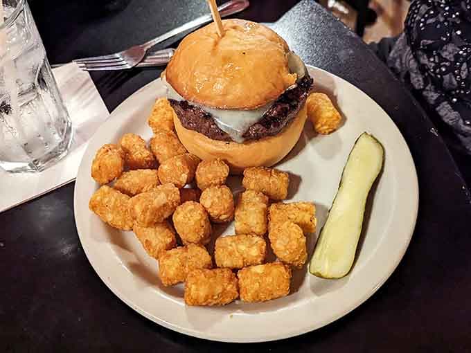 That Mushroom Swiss Burger could make a vegetarian weep, served with tater tots that deserve their own standing ovation.