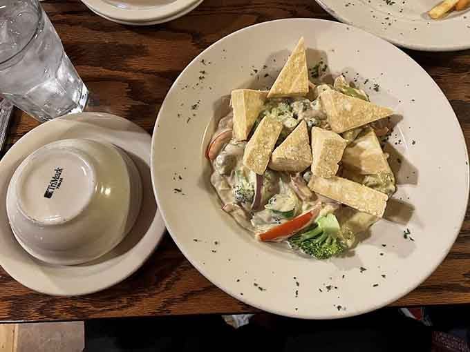 The tofu version proves that plant-based eating doesn't mean flavor-free living, each cube perfectly crispy and curry-soaked.