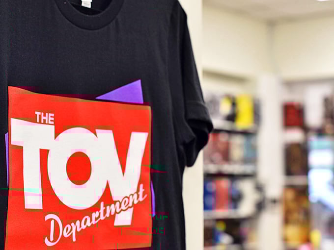 Wear your nostalgia proudly! The Toy Department's branded merchandise lets you show the world you're still a kid at heart.