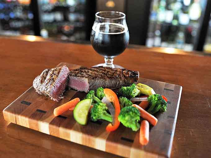 A perfectly grilled Top Sirloin steak with colorful vegetables &ndash; simple food executed with steakhouse precision.