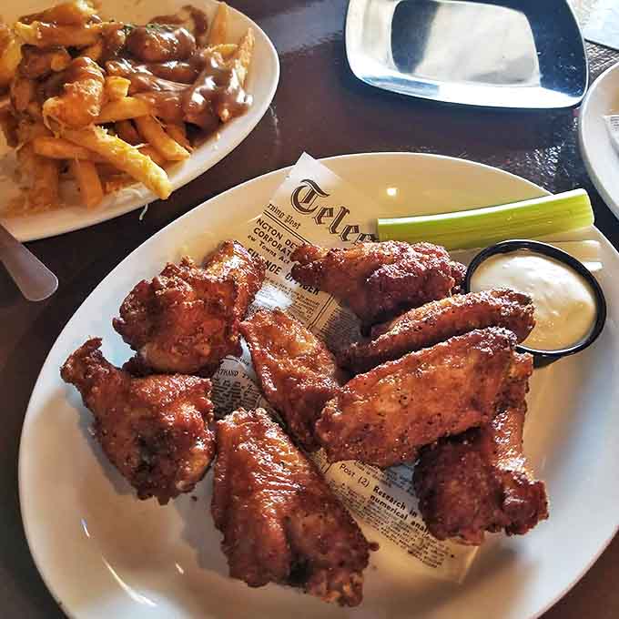 These traditional wings aren't just food&mdash;they're an experience. Notice that perfect sauce-to-crisp ratio that keeps regulars coming back.