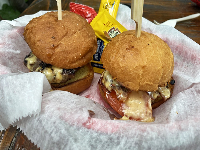 Umami Sliders: Burger perfection in miniature form – juicy patties topped with gruyere, bacon, and a special sauce that makes grown adults consider licking the wrapper.