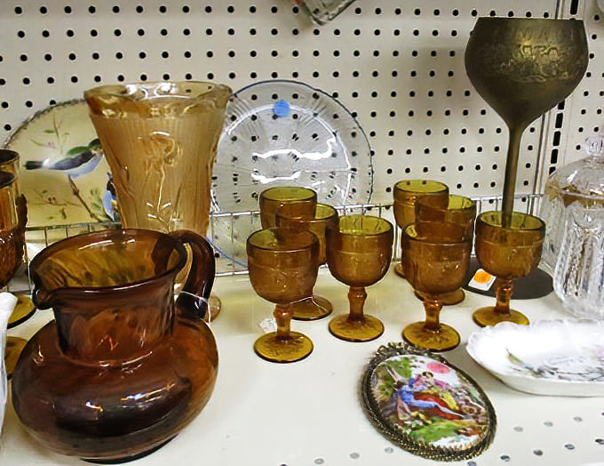 Amber glassware catches the light like liquid honey, each goblet waiting to elevate your next dinner party.