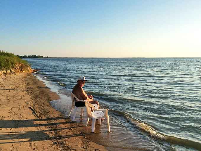 Some bring books, others bring chairs, but everyone finds their perfect spot to commune with Lake Huron's rhythmic waves.