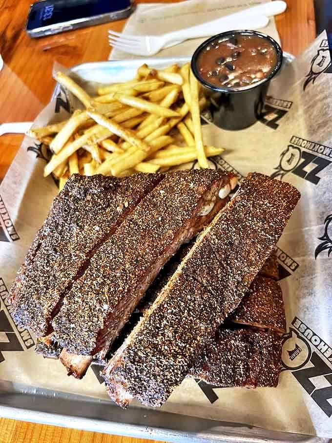 These ribs wear their seasoning like a badge of honor, promising tender meat that'll have you gnawing happily like a cartoon character.