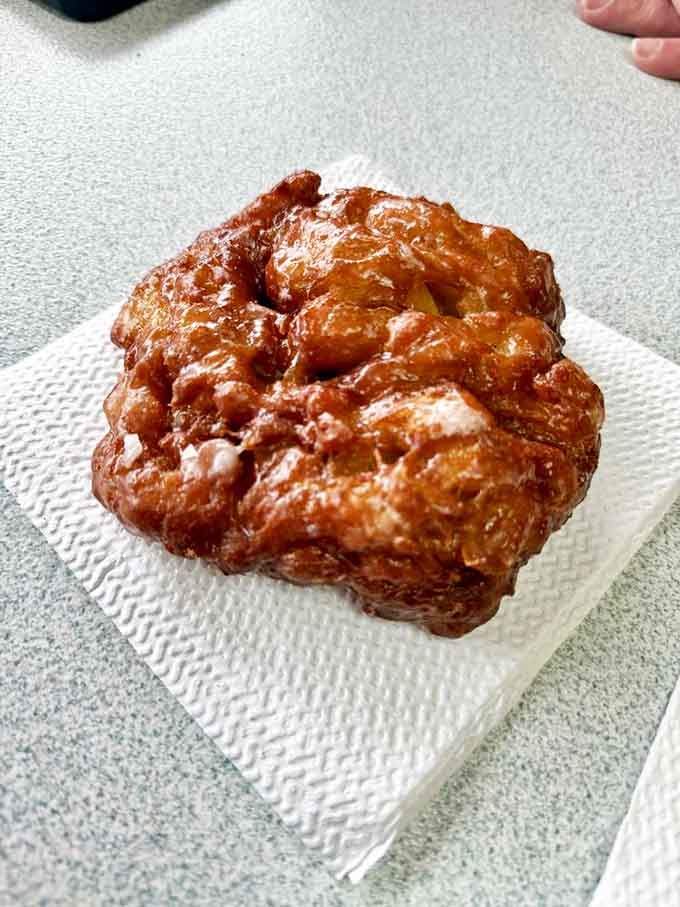 The apple fritter: a masterclass in texture with its caramelized edges and tender, apple-studded interior. Worth every sticky finger that follows.