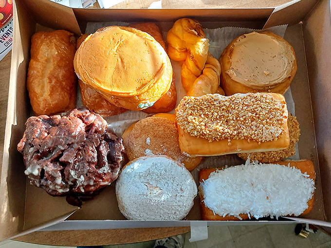 A baker's dozen of joy &ndash; each donut a handcrafted masterpiece that makes choosing just one an exercise in delicious torture.