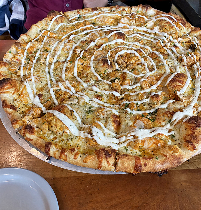 Buffalo chicken pizza swirled with ranch delivers bold flavor and crispy perfection in every slice.