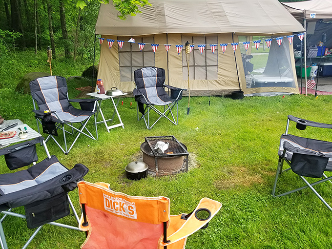 Camping goes Pinterest-worthy with this picture-perfect setup &ndash; complete with patriotic bunting and that essential campfire glow.