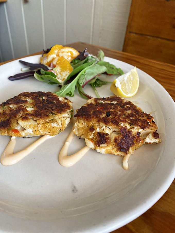 Golden-brown perfection! These crab cakes boast a crispy exterior while maintaining that crucial moist, lump-filled interior that seafood lovers crave.