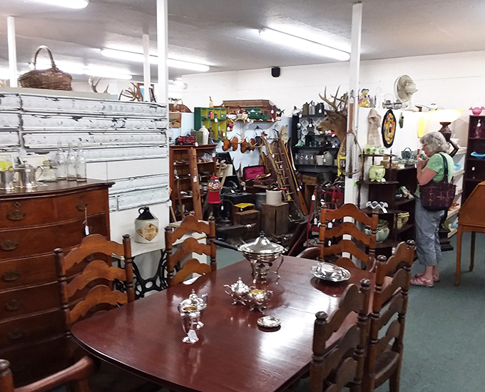 This elegant dining set whispers of Sunday dinners and special occasions past, its wood patina telling stories of generations.