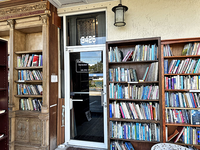 Books spill onto the sidewalk, creating an inviting entrance where outdoor shelves tempt passersby with literary treasures.