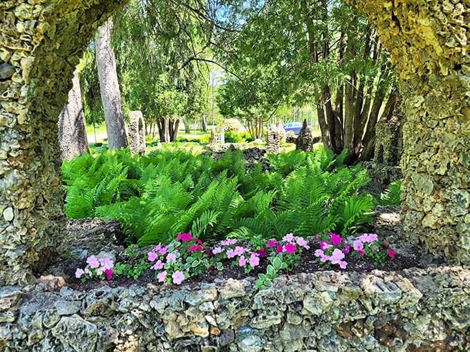 Hostas and ferns embrace these stone sculptures like old friends, proof that nature and art make the best companions.