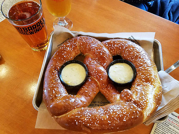 The perfect Minnesota afternoon: a golden-brown Bavarian pretzel paired with a locally crafted beer that complements every salty bite.