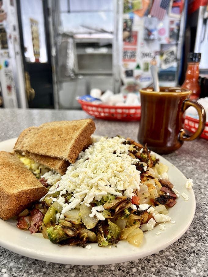 A steaming mug of diner coffee pairs perfectly with the Hippie Hash &ndash; the ideal combination for fueling Ann Arbor adventures.