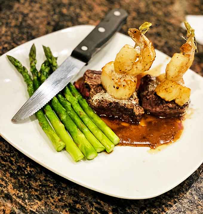 The Land and Sea pairs a tenderloin medallion with scallops and shrimp in a pinot noir demi-glace &ndash; indulgence defined on a single plate.