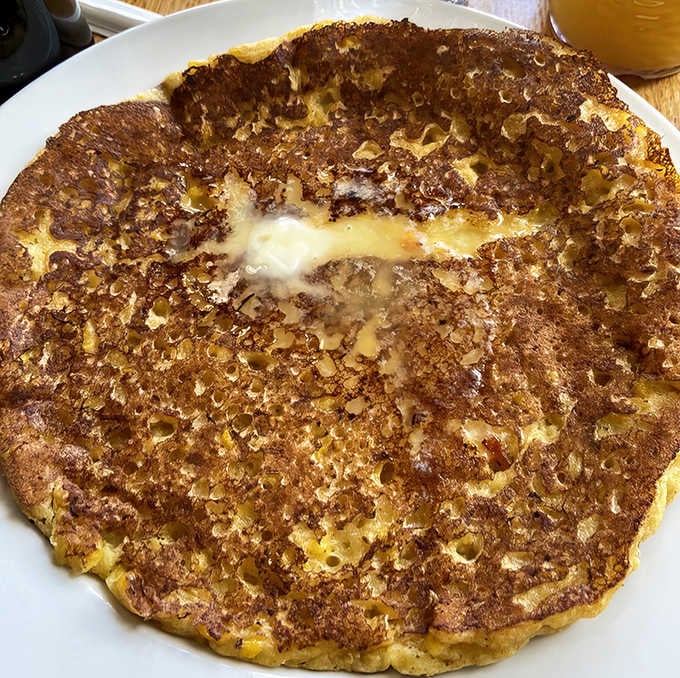 Look at that perfect pancake! The crispy edges give way to a tender interior studded with sweet corn kernels—comfort food that speaks a universal language.