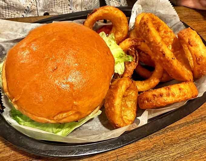 A match made in Michigan heaven &ndash; the olive burger paired with golden onion rings creates a combo that's been making taste buds dance since before Instagram food photos existed.