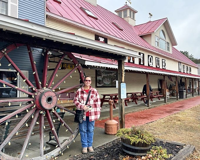 A visitor poses outside the distinctive facade, perhaps contemplating which of Vermont's treasures will be coming home with them.