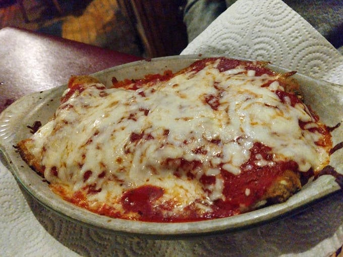 From another angle, the chicken parmesan reveals its perfect layers. Like geological strata, but delicious enough to make you weep.