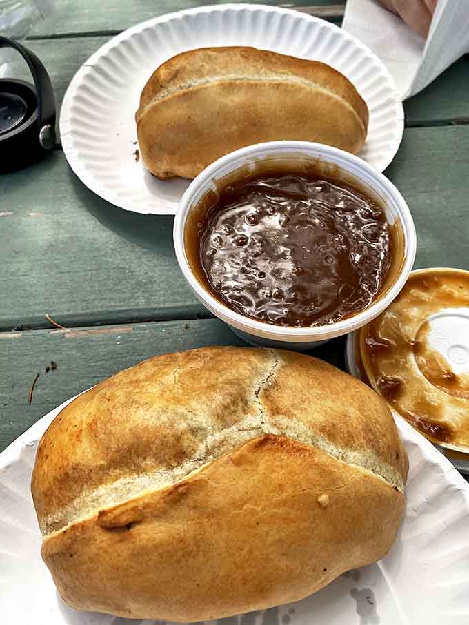 Golden-brown pasties served with a side of rich gravy &ndash; the debate rages on whether to dip, pour, or enjoy them unadorned.