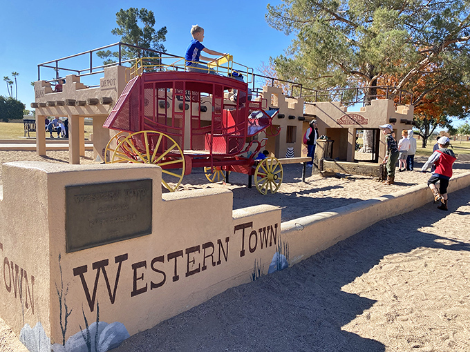 Western Town's playground invites young conductors to climb aboard this red stagecoach, where the Wild West meets childhood imagination.