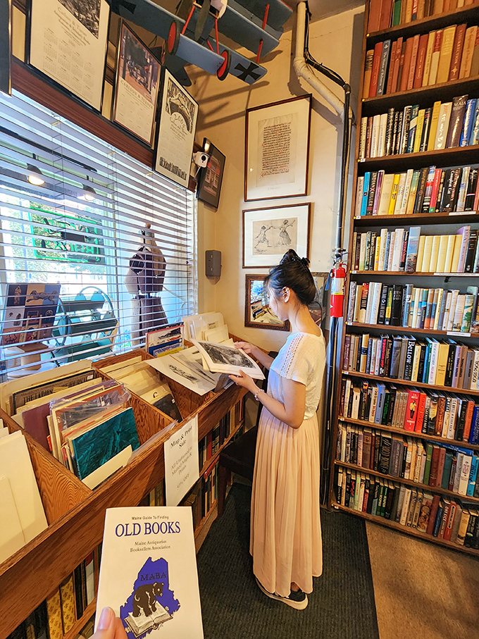 Lost in literary worlds &ndash; a visitor explores the shop's treasures, each book a doorway to another time and place.