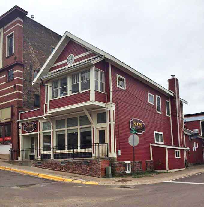 This vibrant red restaurant building stands out against Houghton's skyline, promising hearty meals that reflect the area's diverse cultural influences.