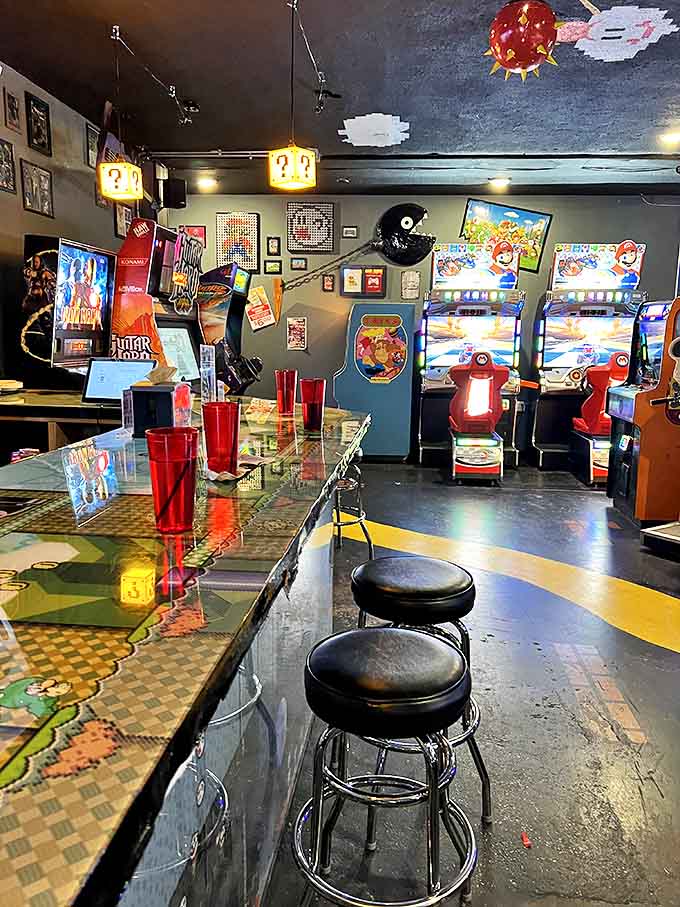 Retro gaming heaven awaits with perfectly maintained cabinets lined up like soldiers, ready for your quarters and competitive spirit.