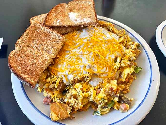 When your scramble comes loaded with this much cheese and perfectly cooked ingredients, breakfast suddenly becomes the most important meal ever invented.