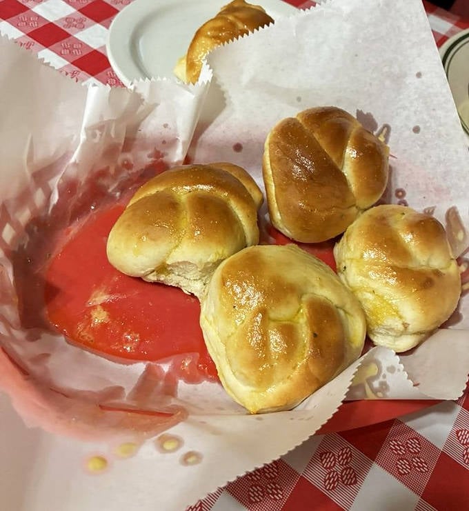 A basket of garlic knots arrives like edible Christmas morning &ndash; the gift that keeps on giving until every last one disappears.