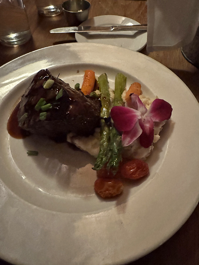 The legendary steak arrives with asparagus and mashed potatoes&mdash;a plate that proves food doesn't need to be complicated to be extraordinary.