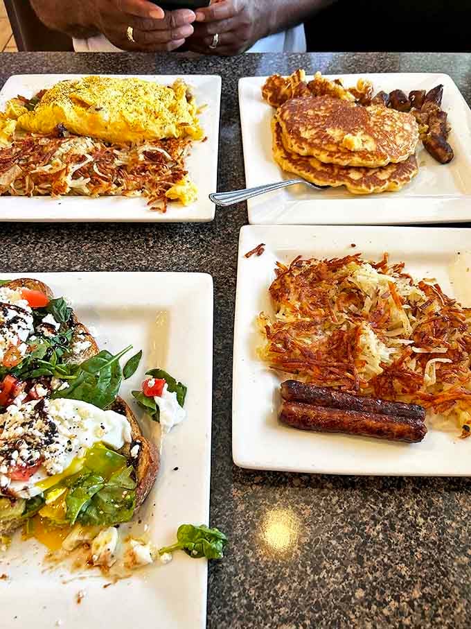 Breakfast paradise on display: fluffy omelets, crispy hash browns, and pancakes that make you question all other pancakes you've encountered.