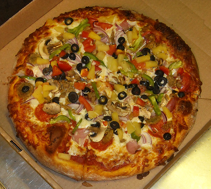 Garden-fresh toppings create a colorful mosaic atop perfectly melted cheese &ndash; proof that vegetarian options need never be boring.