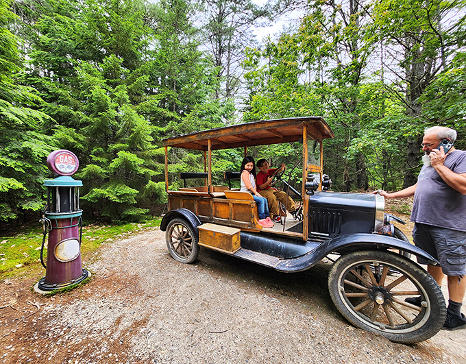 Vintage transportation meets desert exploration as visitors enjoy a ride in a classic vehicle, proving old-school cool never goes out of style.